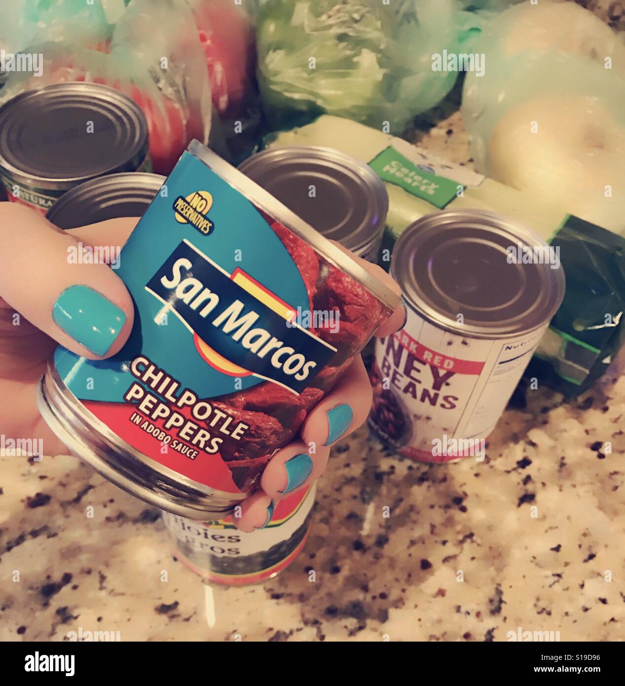 Hand holding can hi-res stock photography and images - Alamy