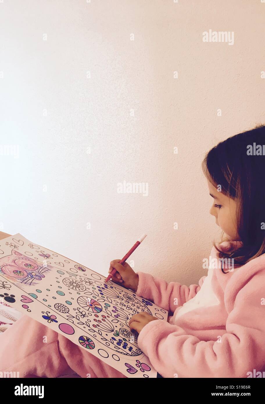 Little girl coloring a picture Stock Photo - Alamy