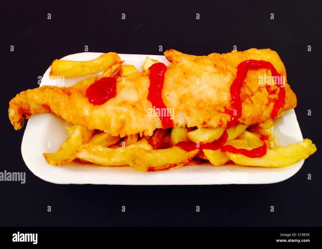 Take away cod & chips with tomato ketchup Stock Photo - Alamy