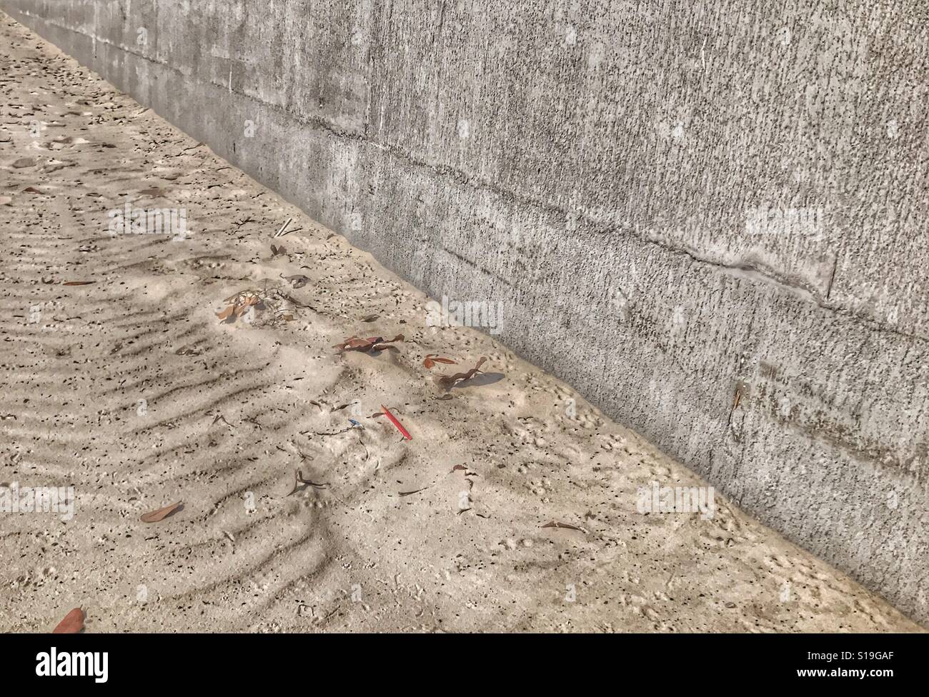 Wall in the sand Stock Photo - Alamy