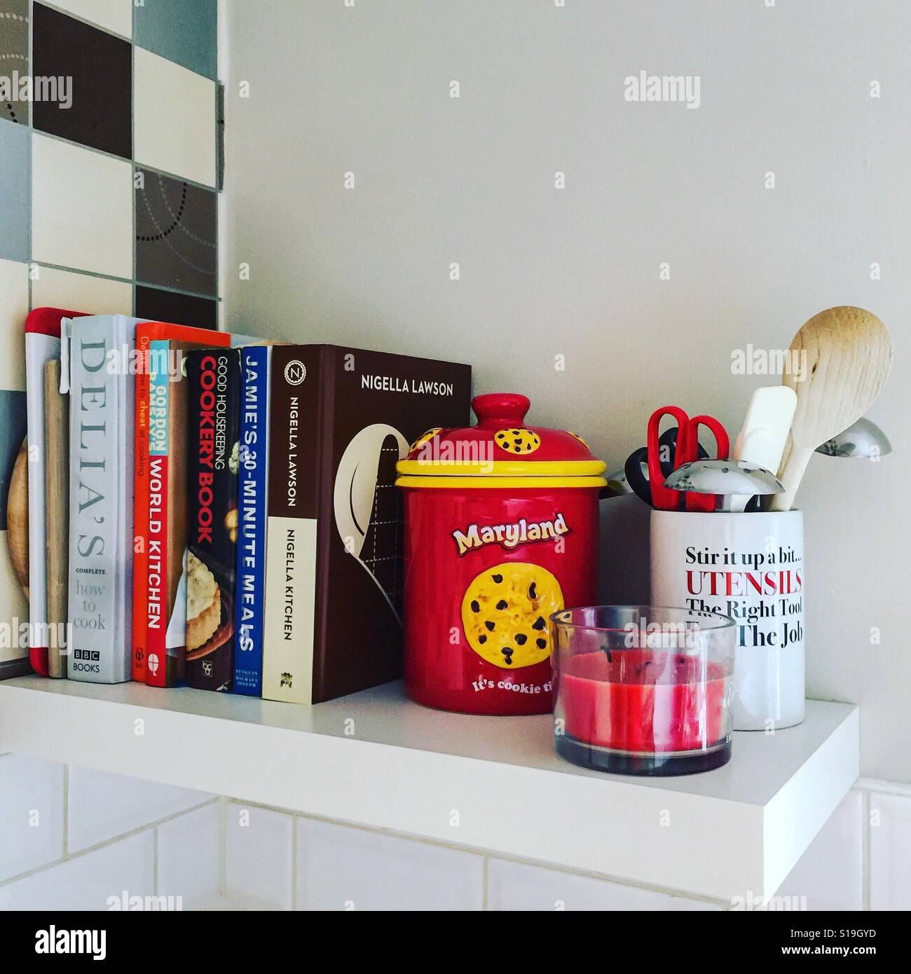 Cookbooks on a kitchen shelf Stock Photo - Alamy