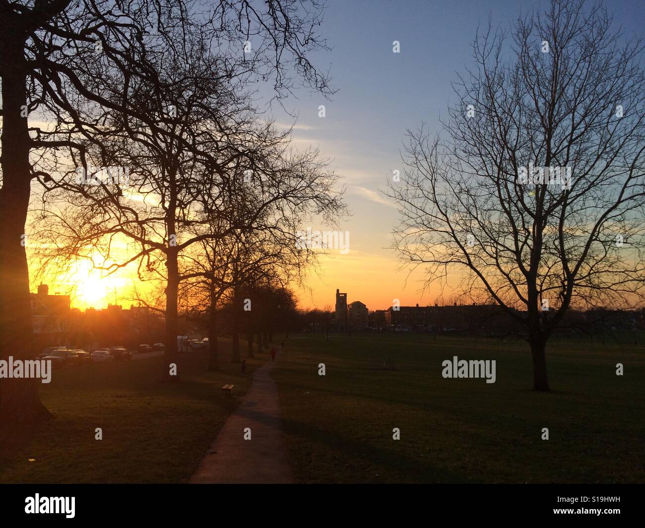 Looking down a path at sunset Stock Photo - Alamy