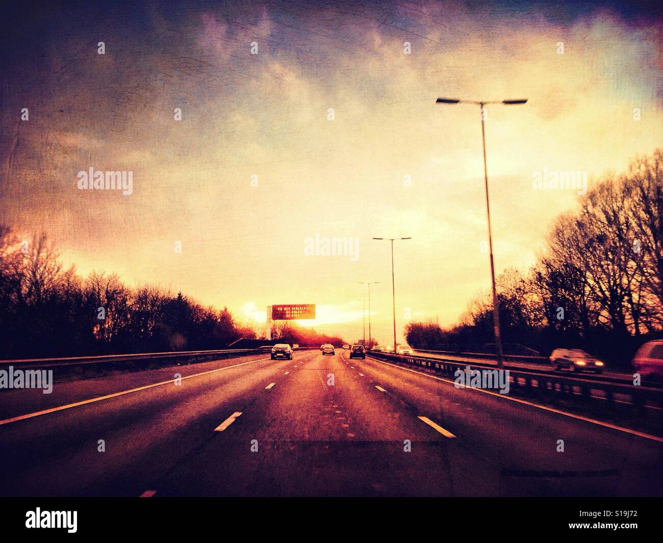 Driving towards the sunset on the M4 motorway in Berkshire Stock Photo ...