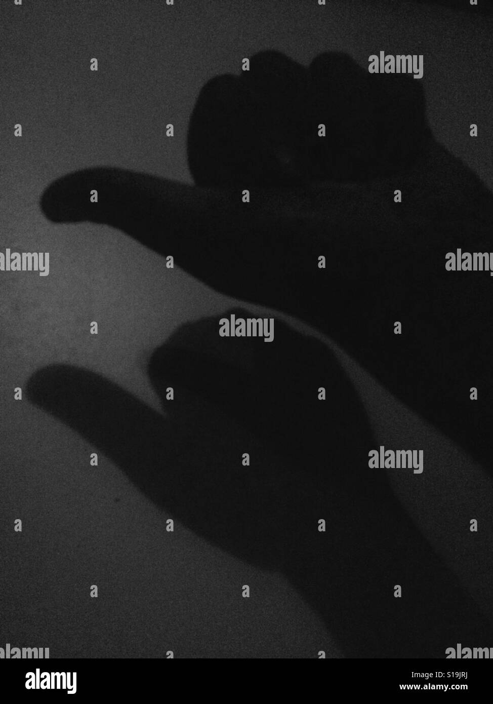 Thumbs up shadow Stock Photo - Alamy