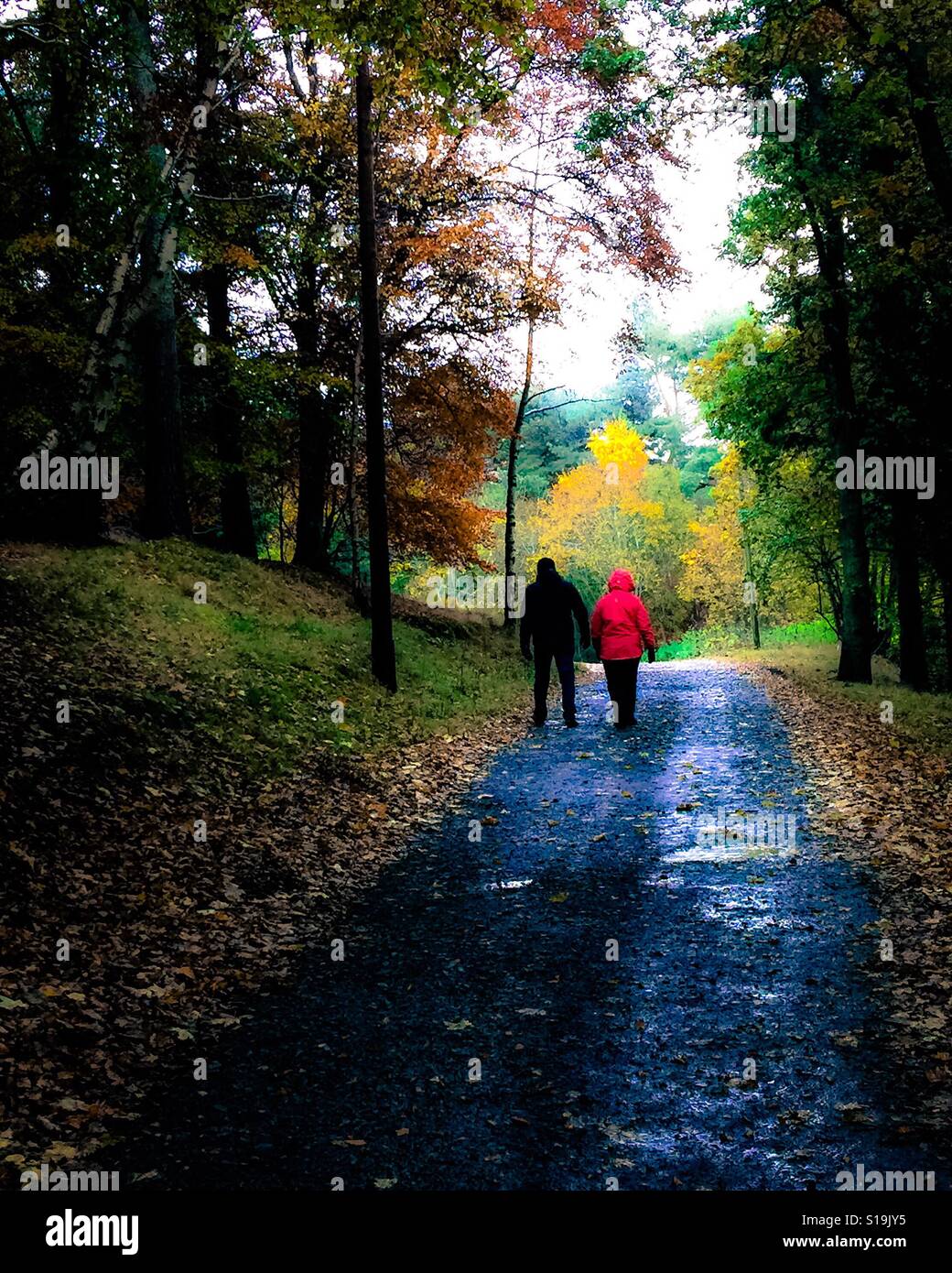 Couple walking along a track hi-res stock photography and images - Alamy