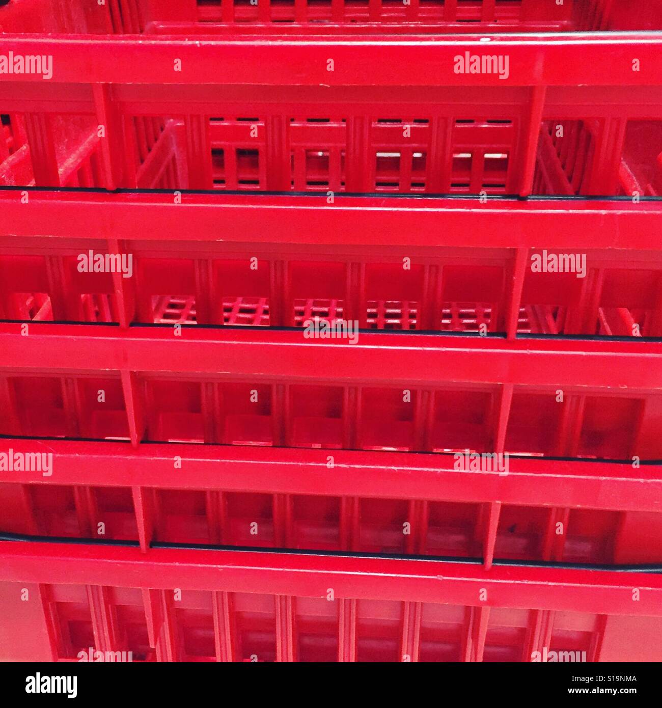 A stack of red baskets by K.R Stock Photo - Alamy