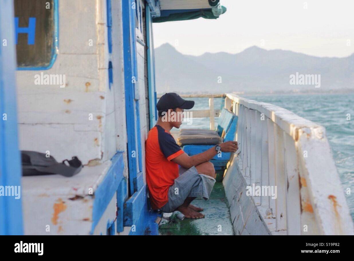 Crew Ship Smoke and Thiking on His Captain Boat Stock Photo - Alamy