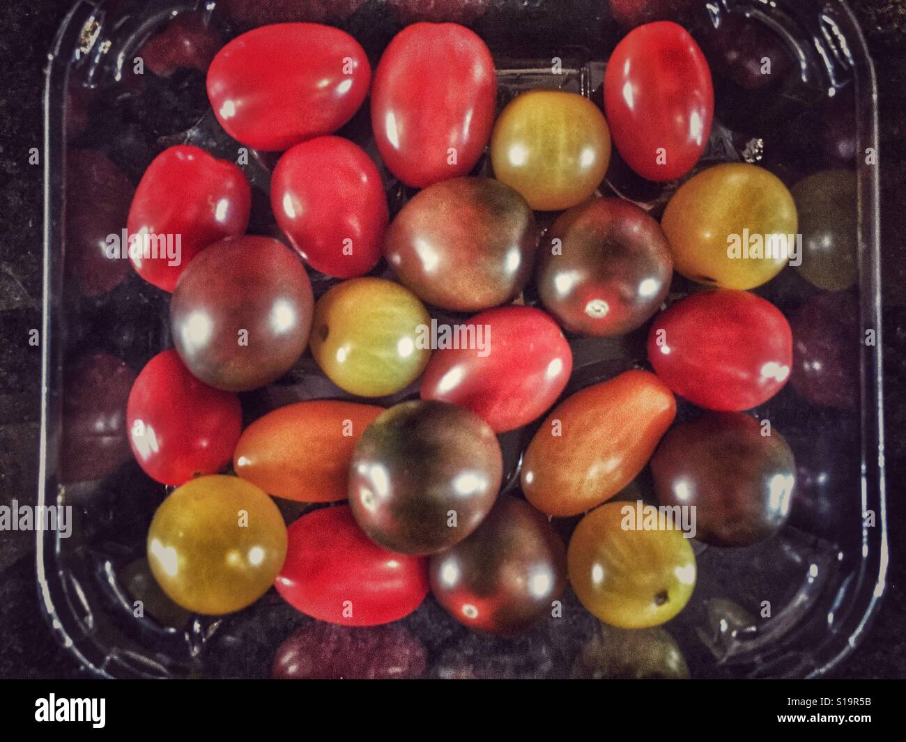 Snack tomatoes in plastic packaging Stock Photo - Alamy