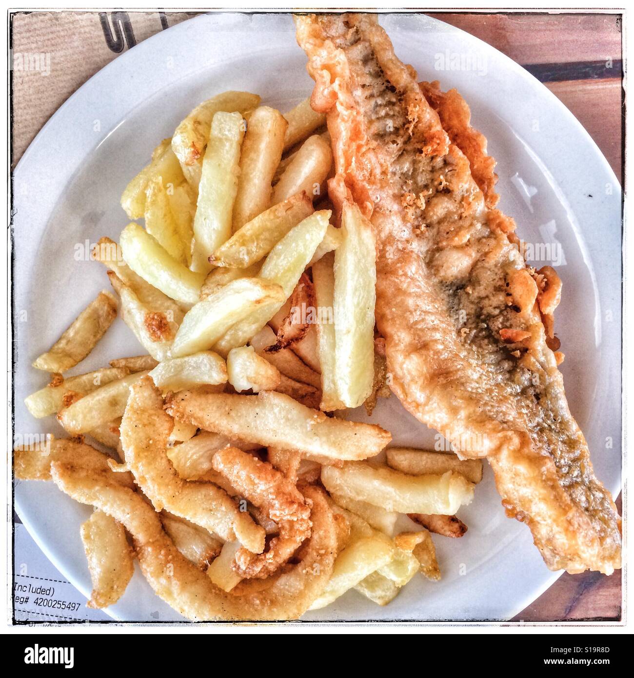 Fish , calamari and chips Stock Photo - Alamy