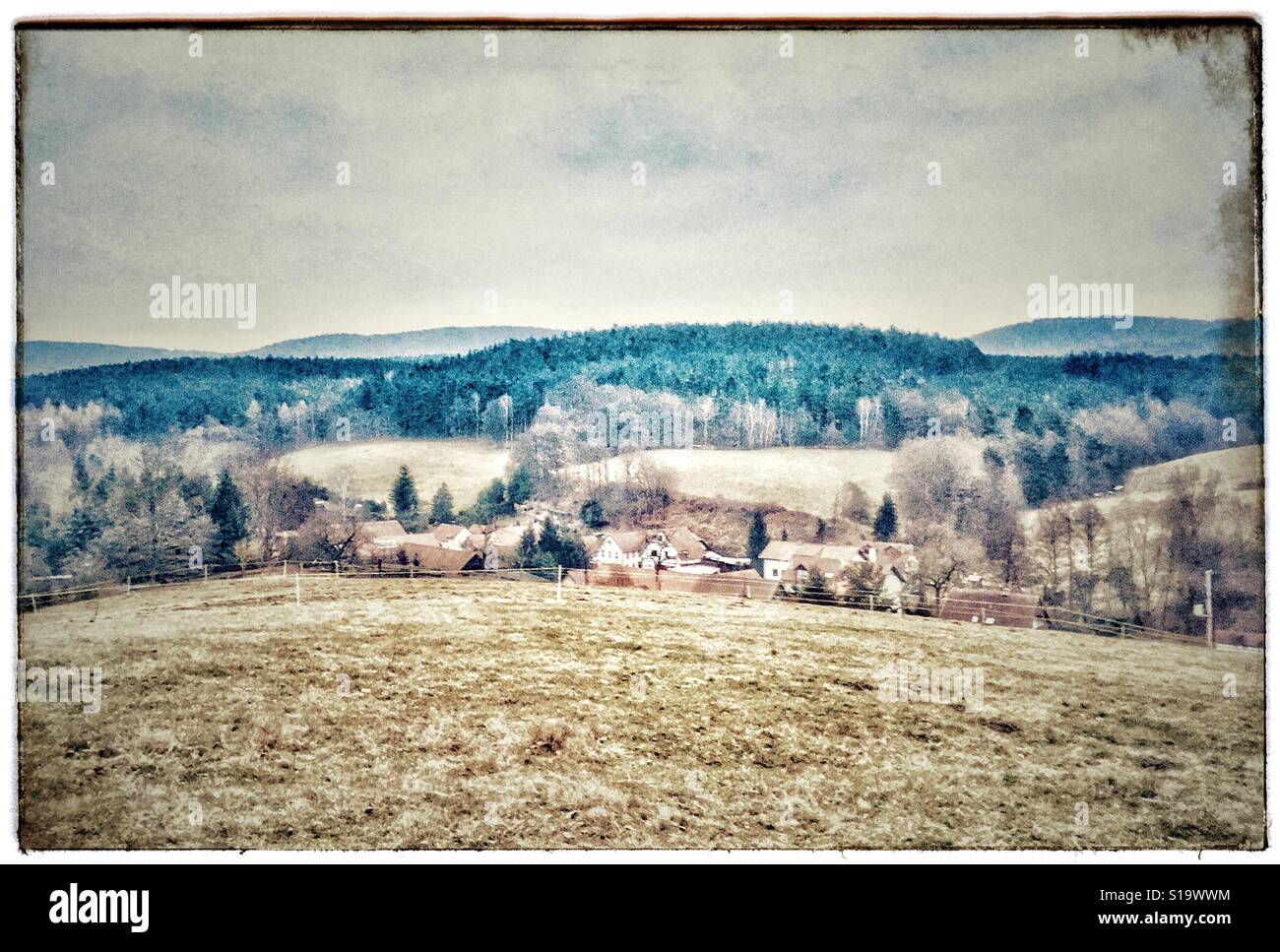 Landscape with the nature, fields, mountains and a small village of ...