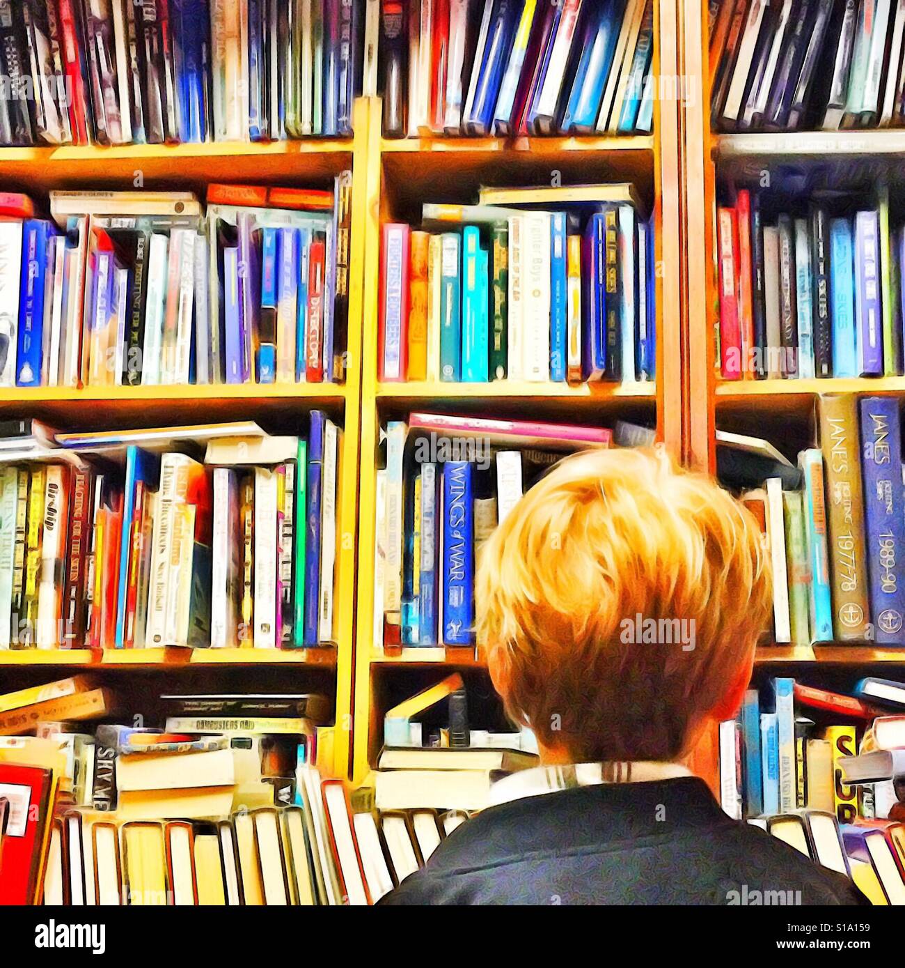 Child looking at books Stock Photo - Alamy