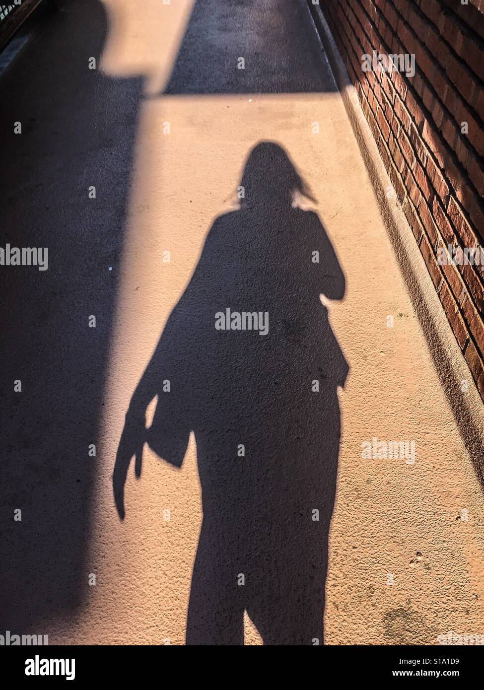 Shadow Woman On Wall Sidewalk High Resolution Stock Photography and ...