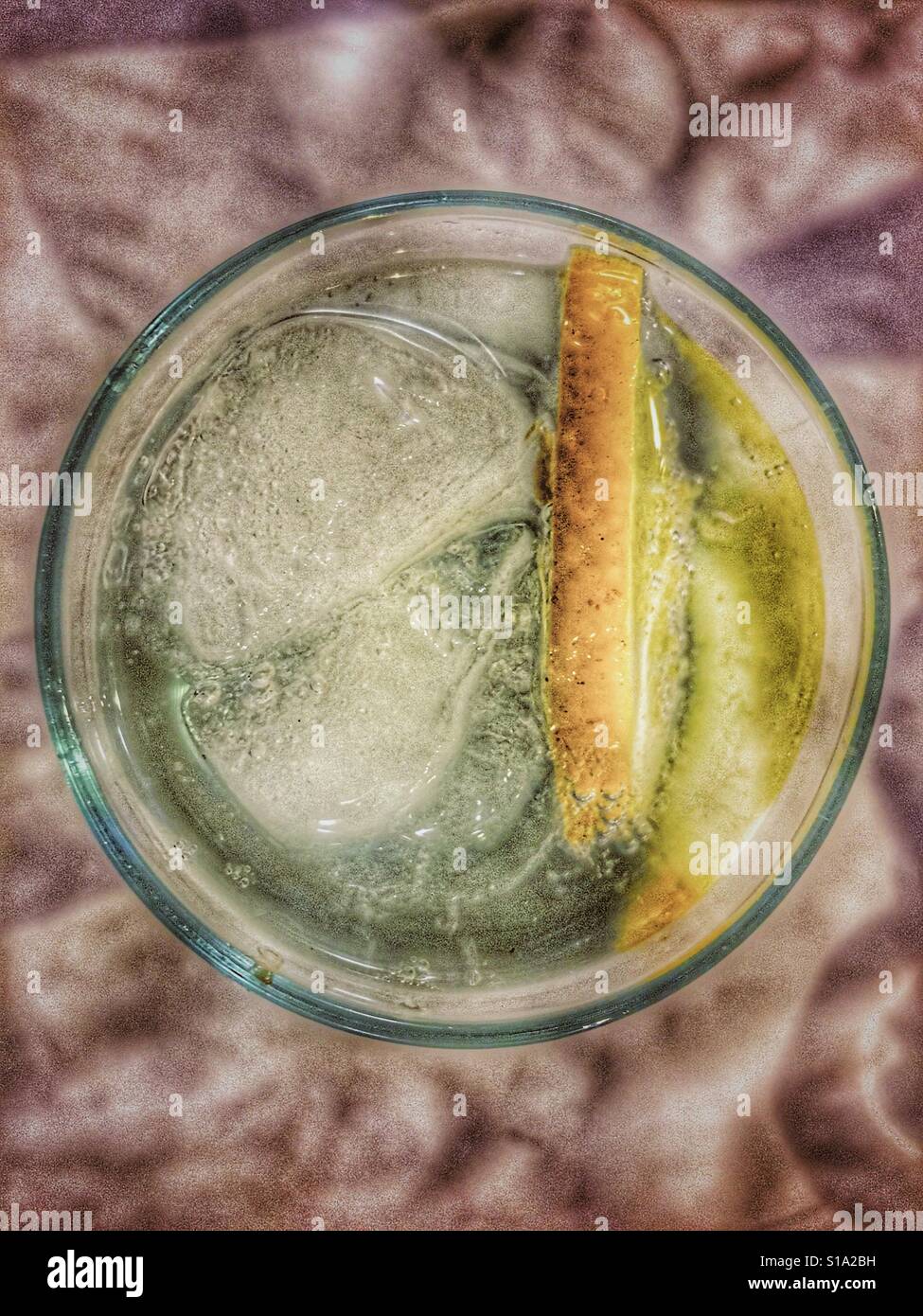 Glass with ice, lemon and clear, fizzy liquid, from above Stock Photo ...