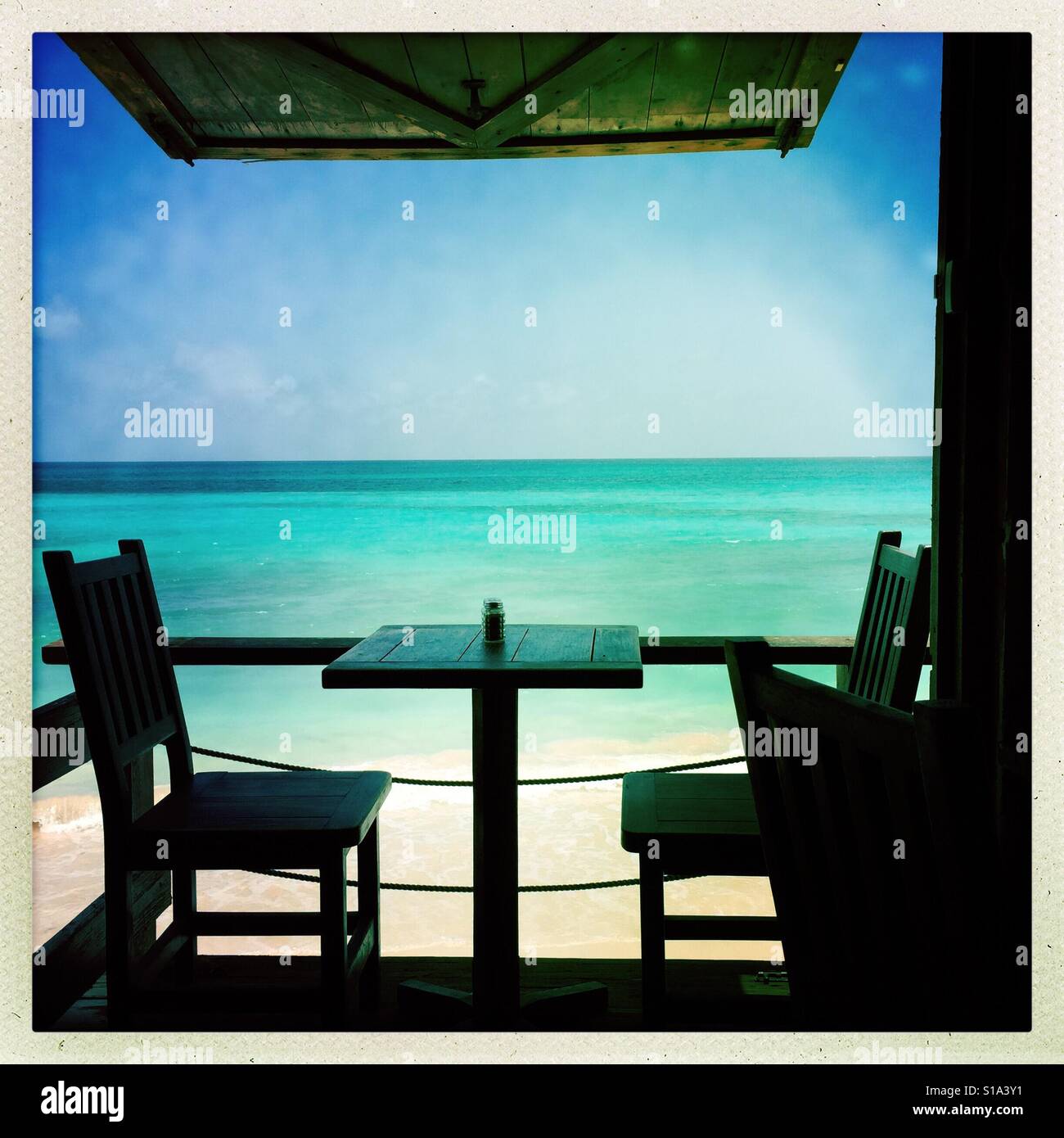 Table for two by the ocean Stock Photo - Alamy