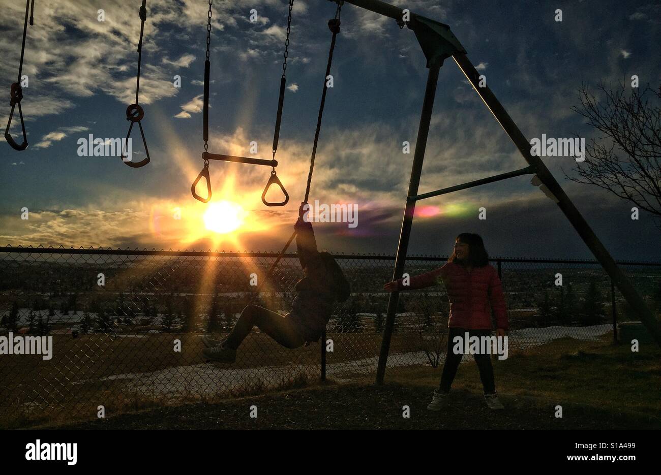 Children playing at sunset Stock Photo - Alamy