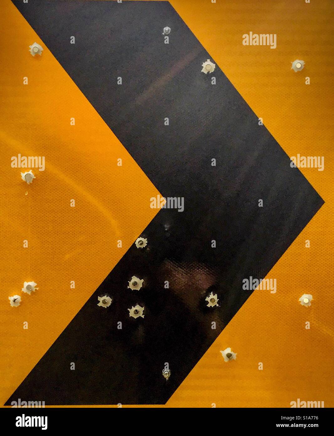 Bullet riddled road sign hi-res stock photography and images - Alamy