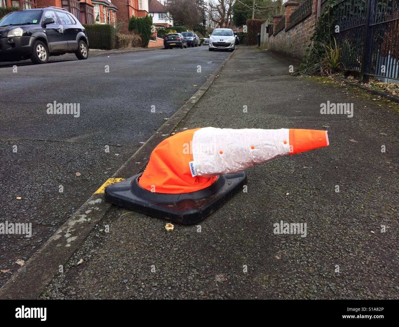 Deflated traffic cone on the roadside in Church Stretton, Shropshire ...