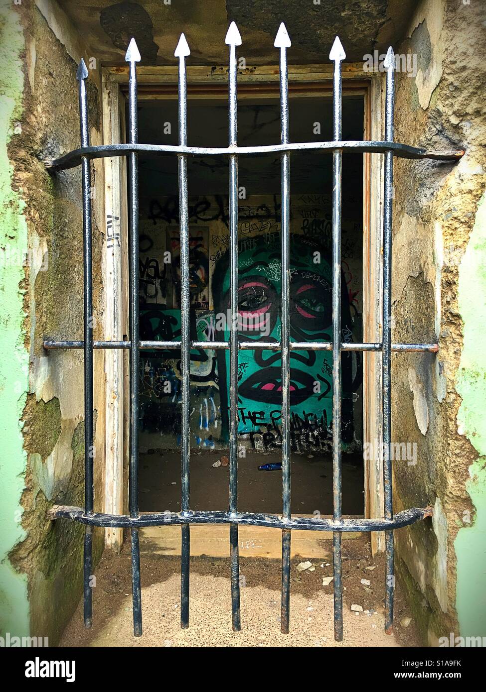 Graffiti behind a barred window at battery Mendell in the Marin ...