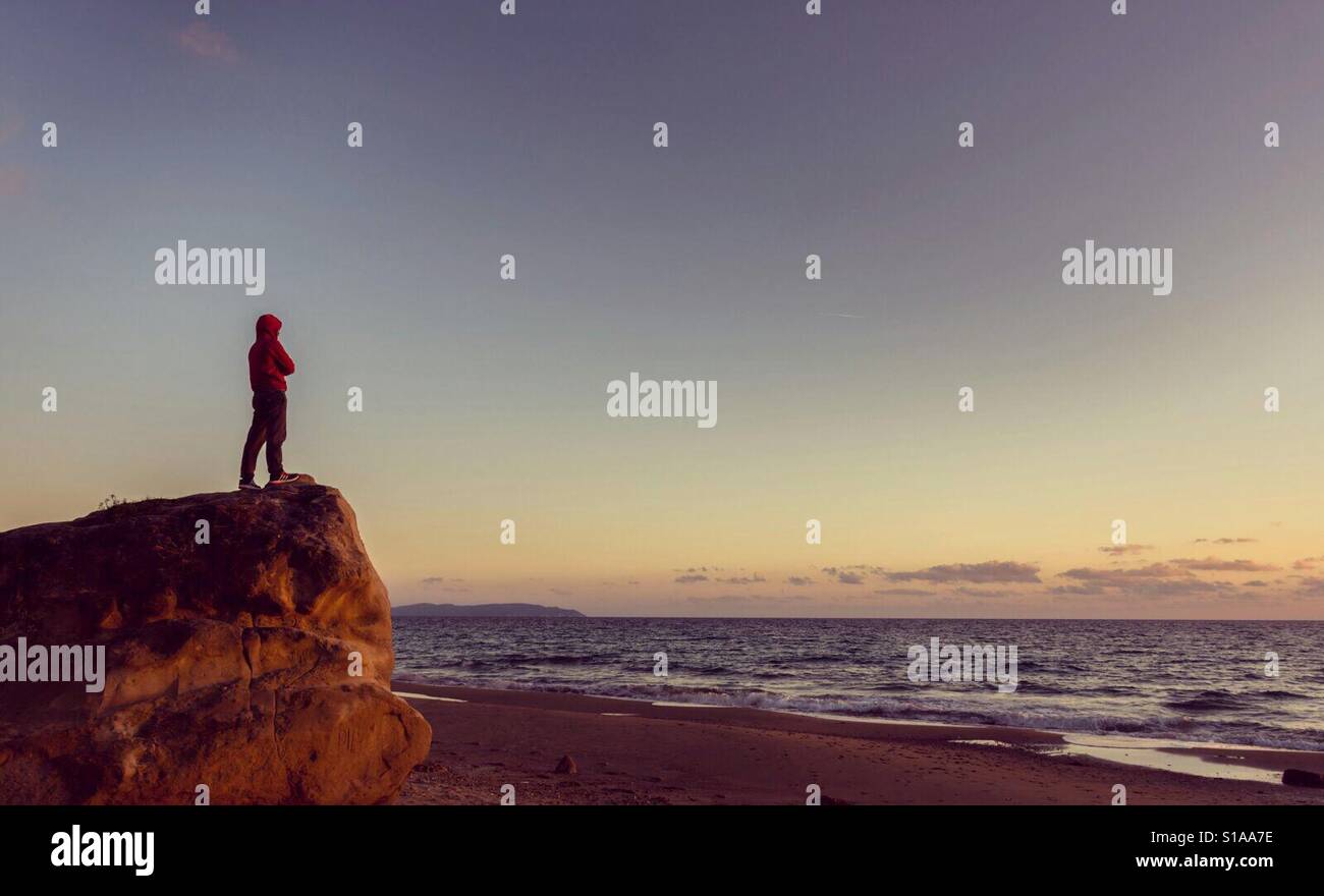 Man looking out over the sea Stock Photo - Alamy