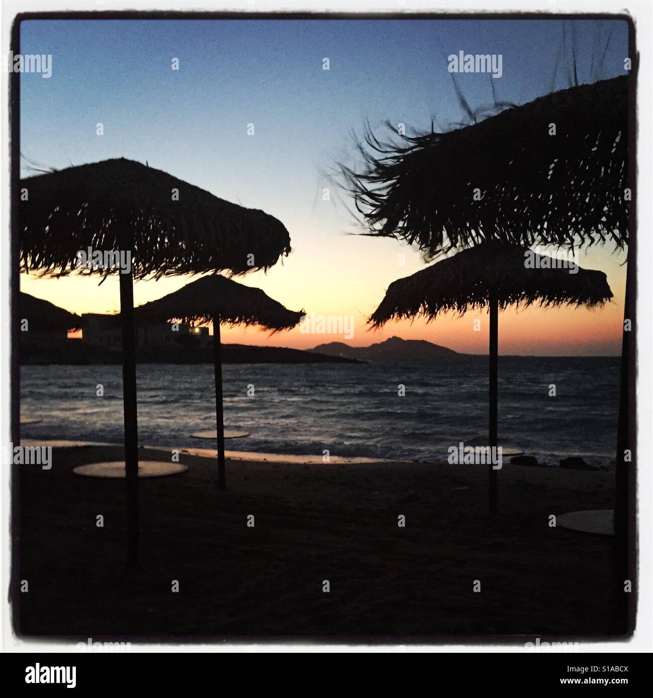 Sunset on the beach at the island Paros - Greece Stock Photo - Alamy