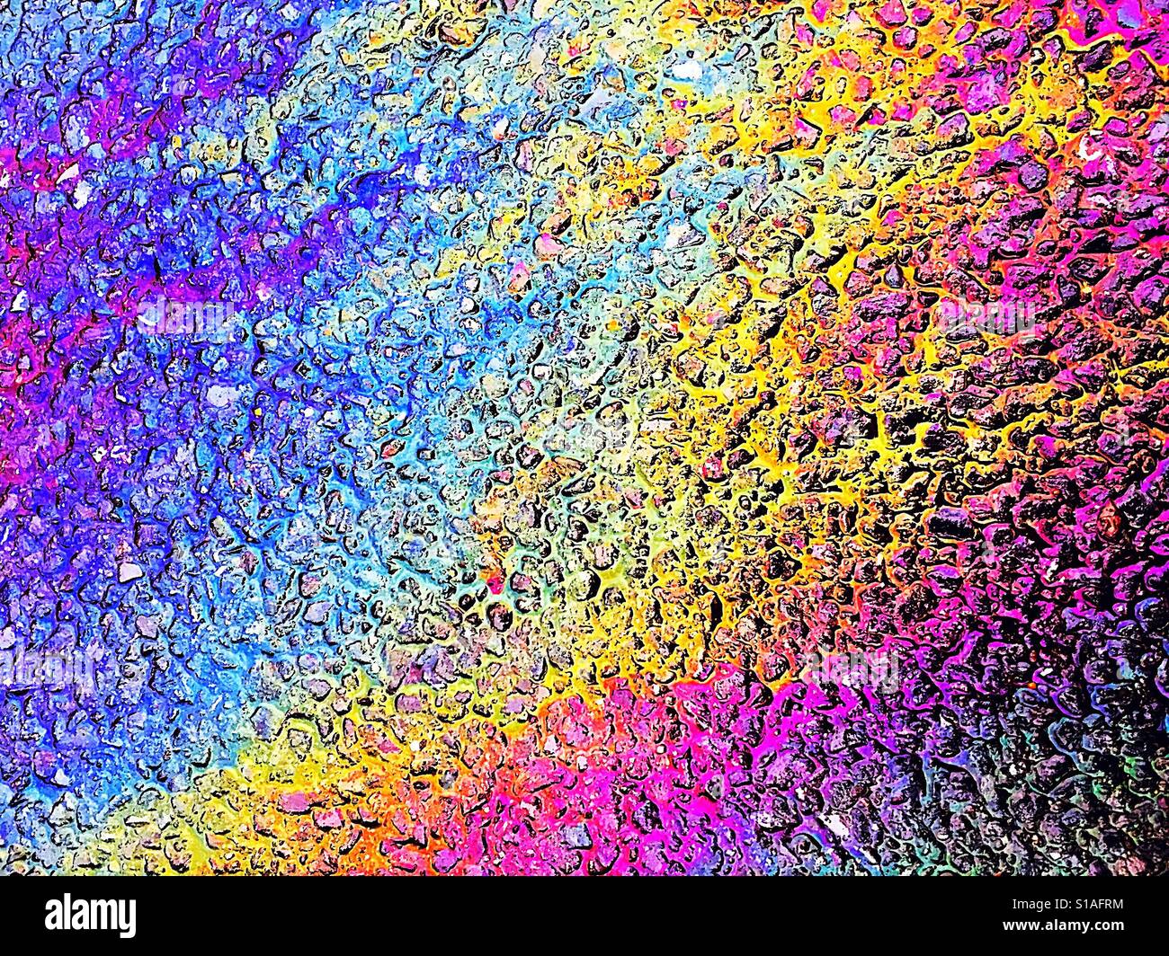 Oil slick rainbow on path Stock Photo - Alamy