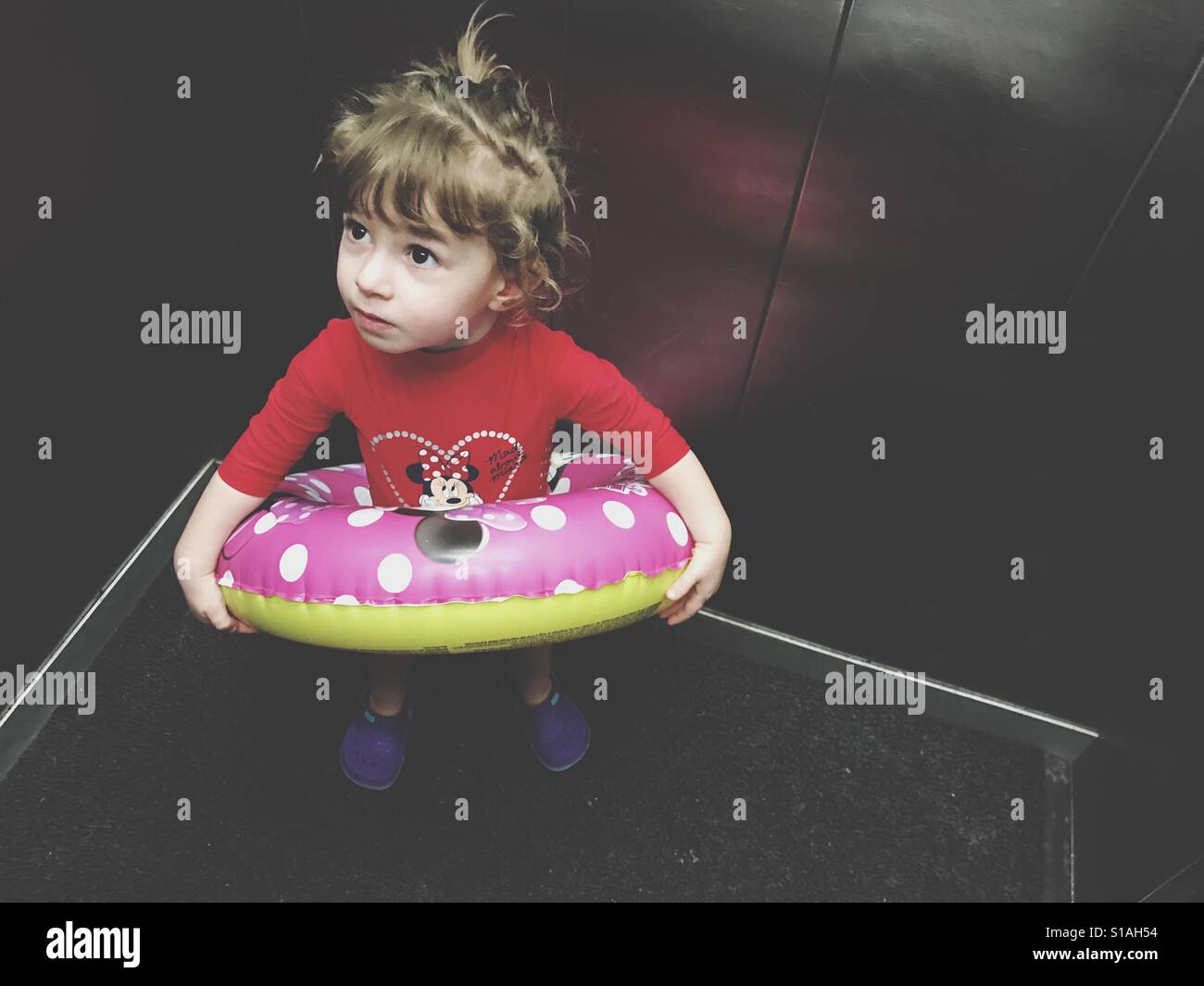 Toddler going to the swimming with inflatable ring Stock Photo - Alamy