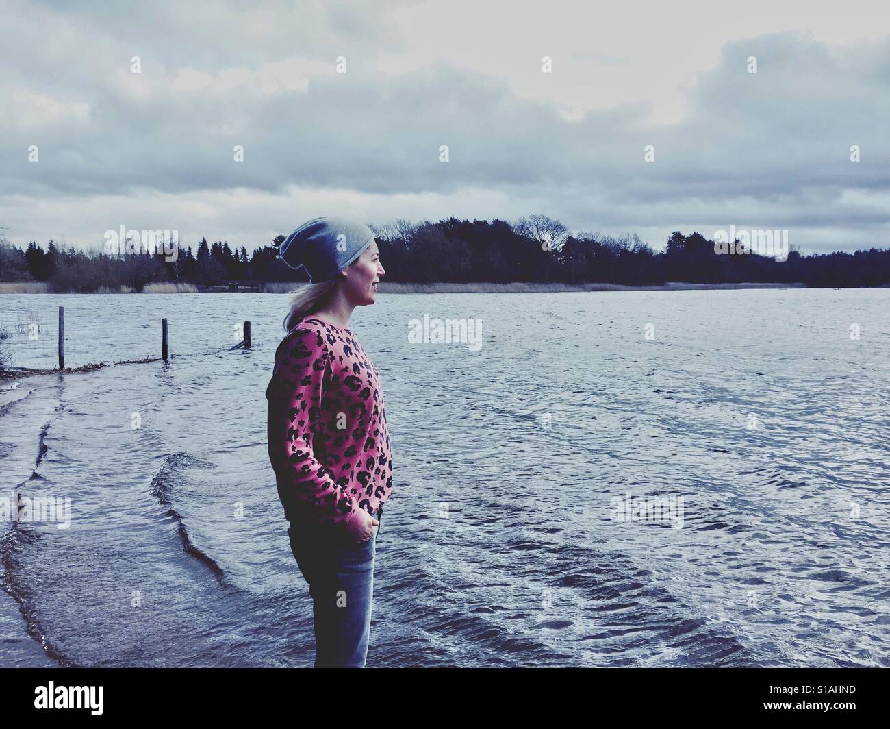 Woman looking out Stock Photo - Alamy