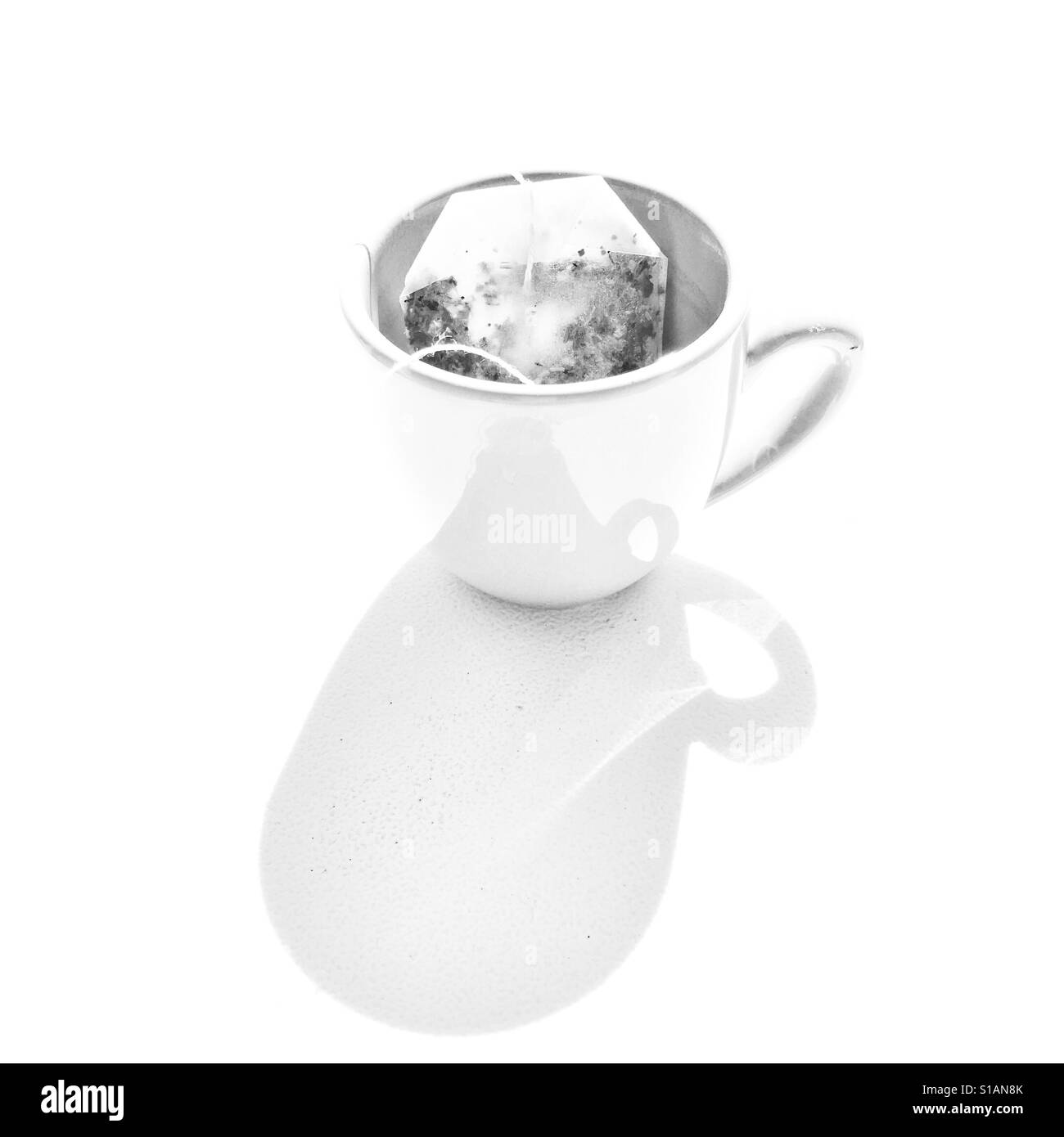 Used tea bag in a cup Stock Photo - Alamy