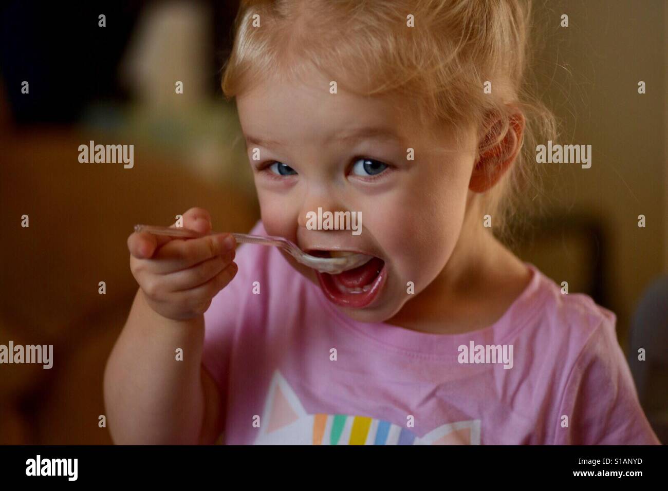 Little child spoon eating hi-res stock photography and images - Alamy