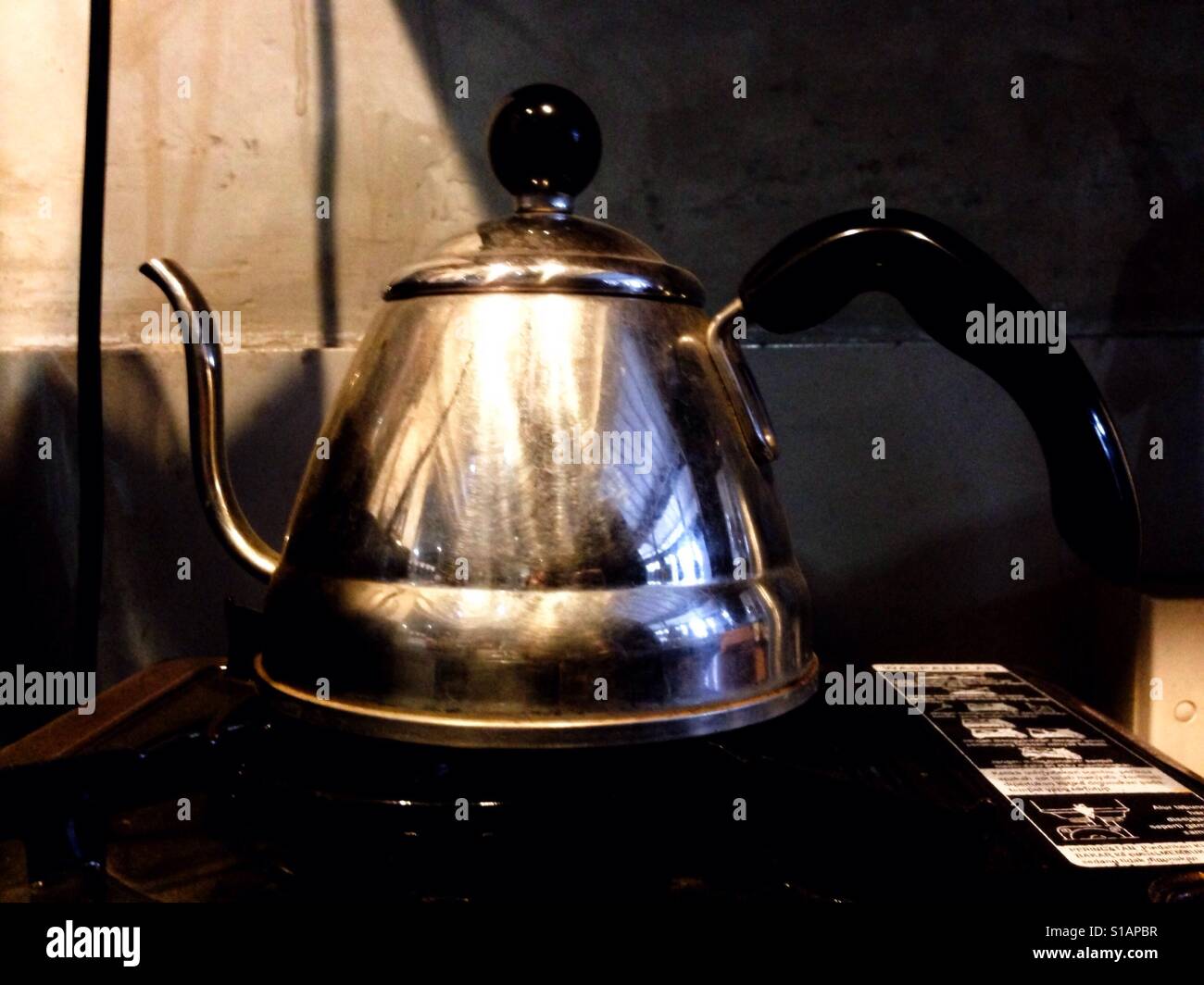 Kettle stove kitchen hi-res stock photography and images - Alamy