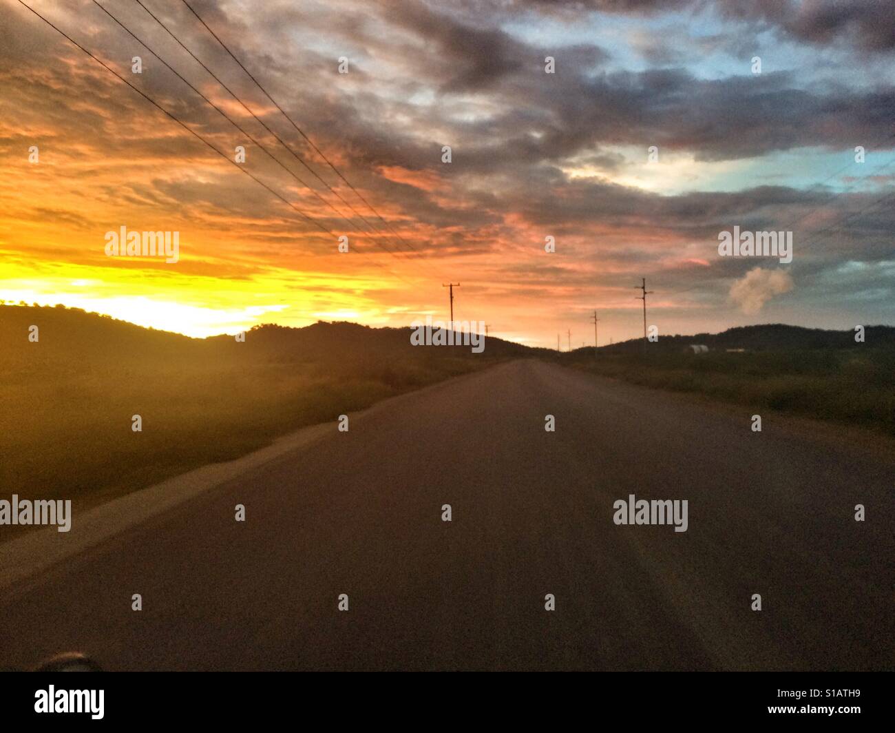 Sunset along the highway Stock Photo - Alamy