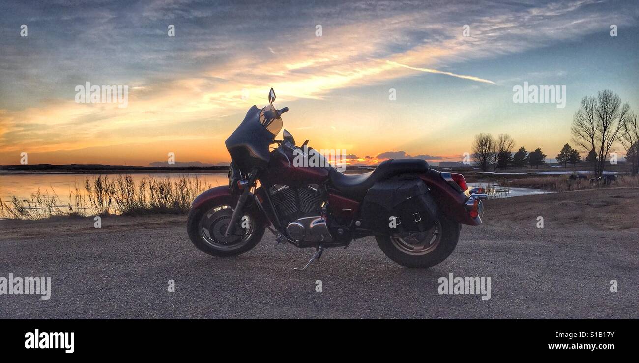 Motorcycle and sunset Stock Photo - Alamy
