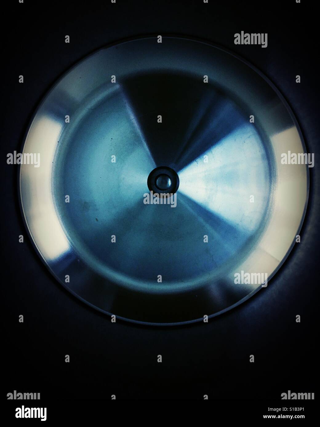 An abstract of the interior of a rice cooker (heater plate and center ...