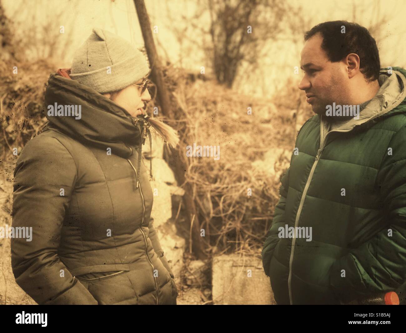 Couple talking outside Stock Photo - Alamy