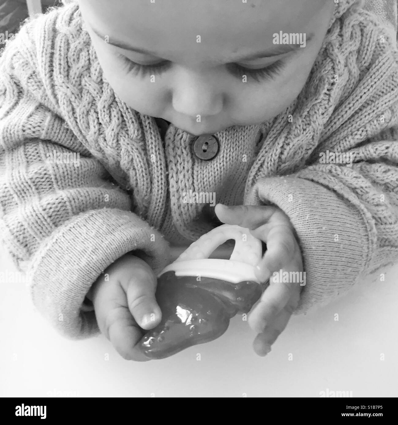A teething baby Stock Photo - Alamy