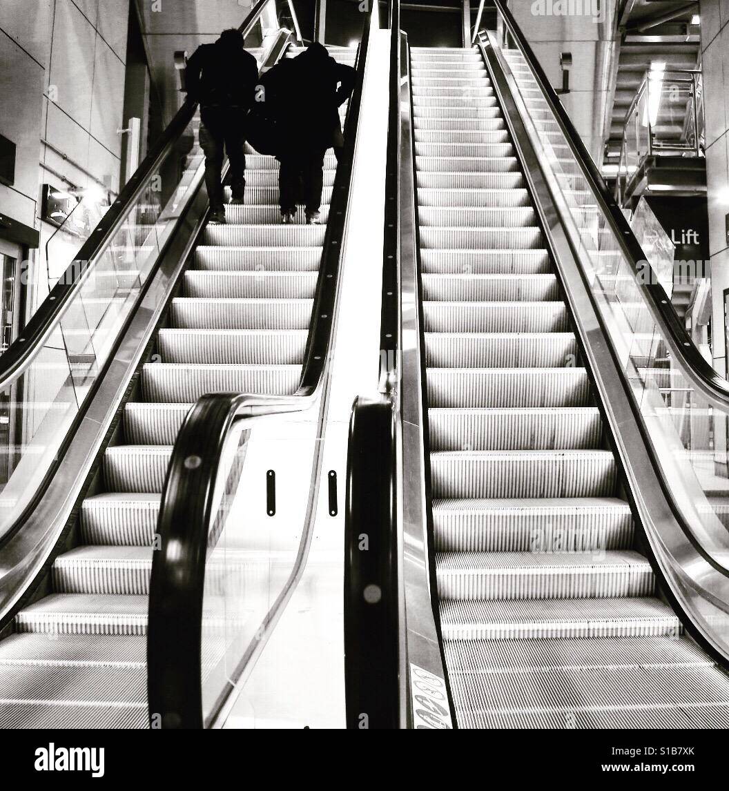 People on an Escalator Stock Photo - Alamy