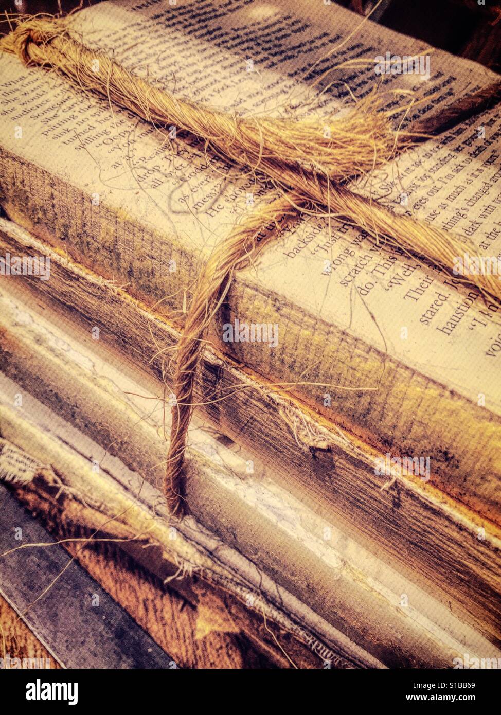 Stack of vintage books with covers removed bound in rope, USA Stock ...