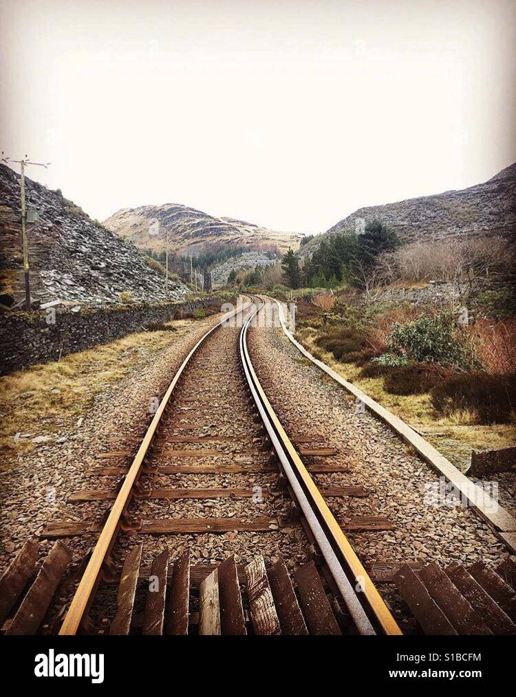 Railway line through mountains in north Wales Stock Photo - Alamy