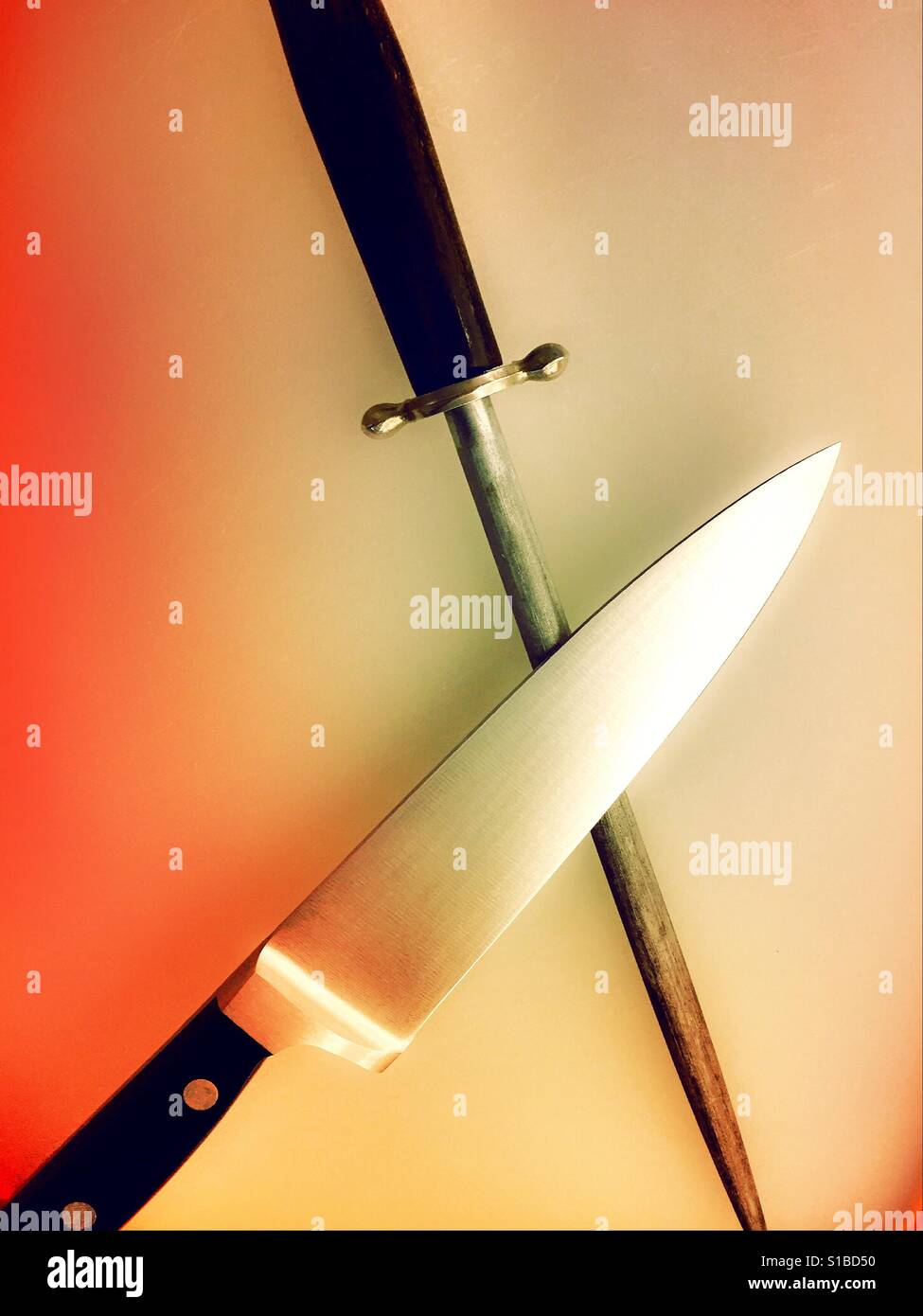 Large kitchen knife and sharpening steel Stock Photo - Alamy