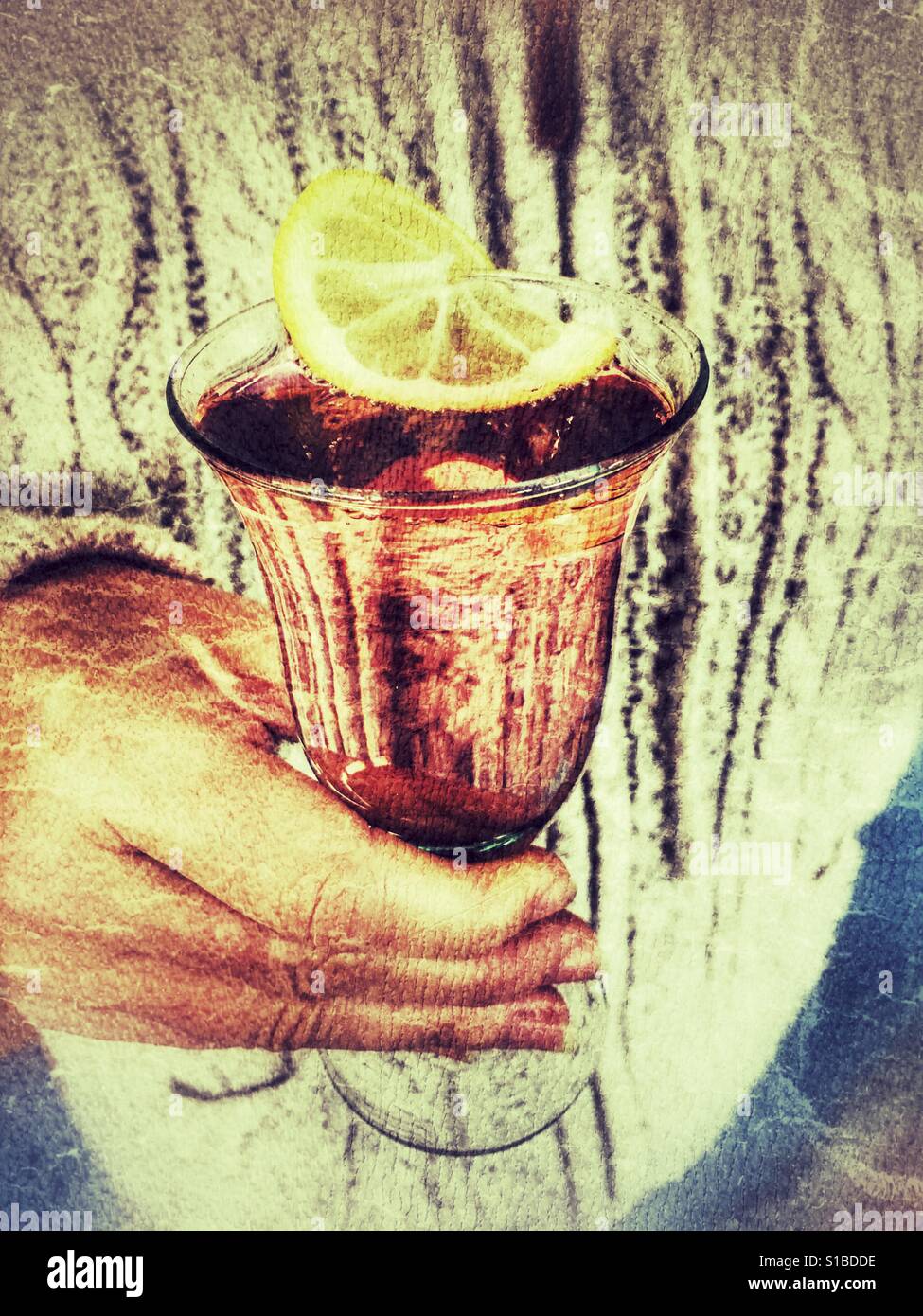 Cocktail in hand Stock Photo - Alamy