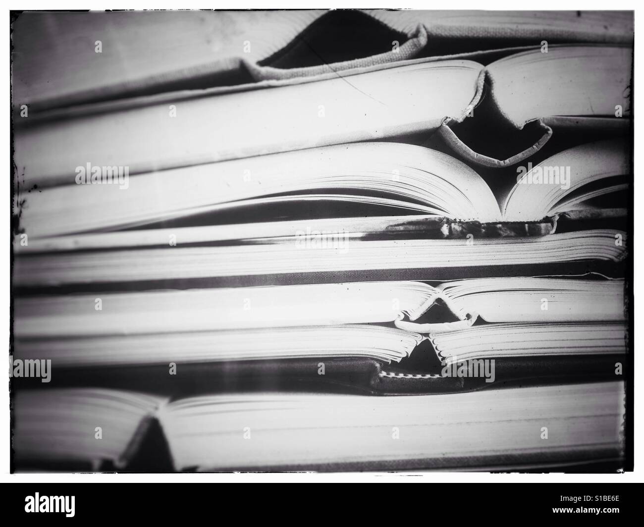 Pile of open books hi-res stock photography and images - Alamy