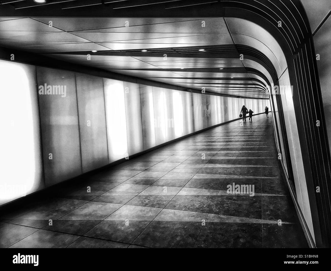Illuminated pedestrian tunnel Black and White Stock Photos & Images - Alamy