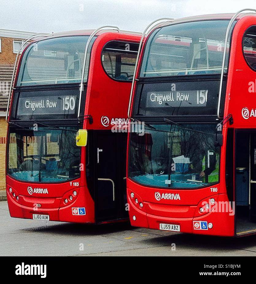Two red London buses Stock Photo - Alamy