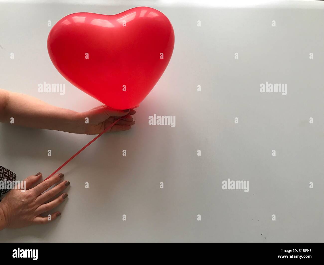 Heart Balloon And Hands Stock Photos & Heart Balloon And Hands Stock ...