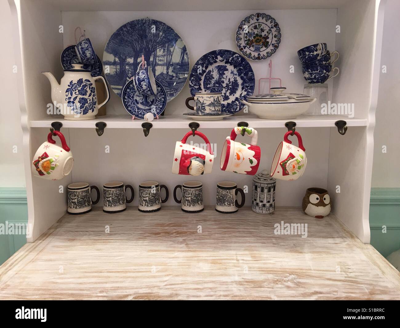 Various tea and coffee mugs on display in a tea and coffee shop with ...