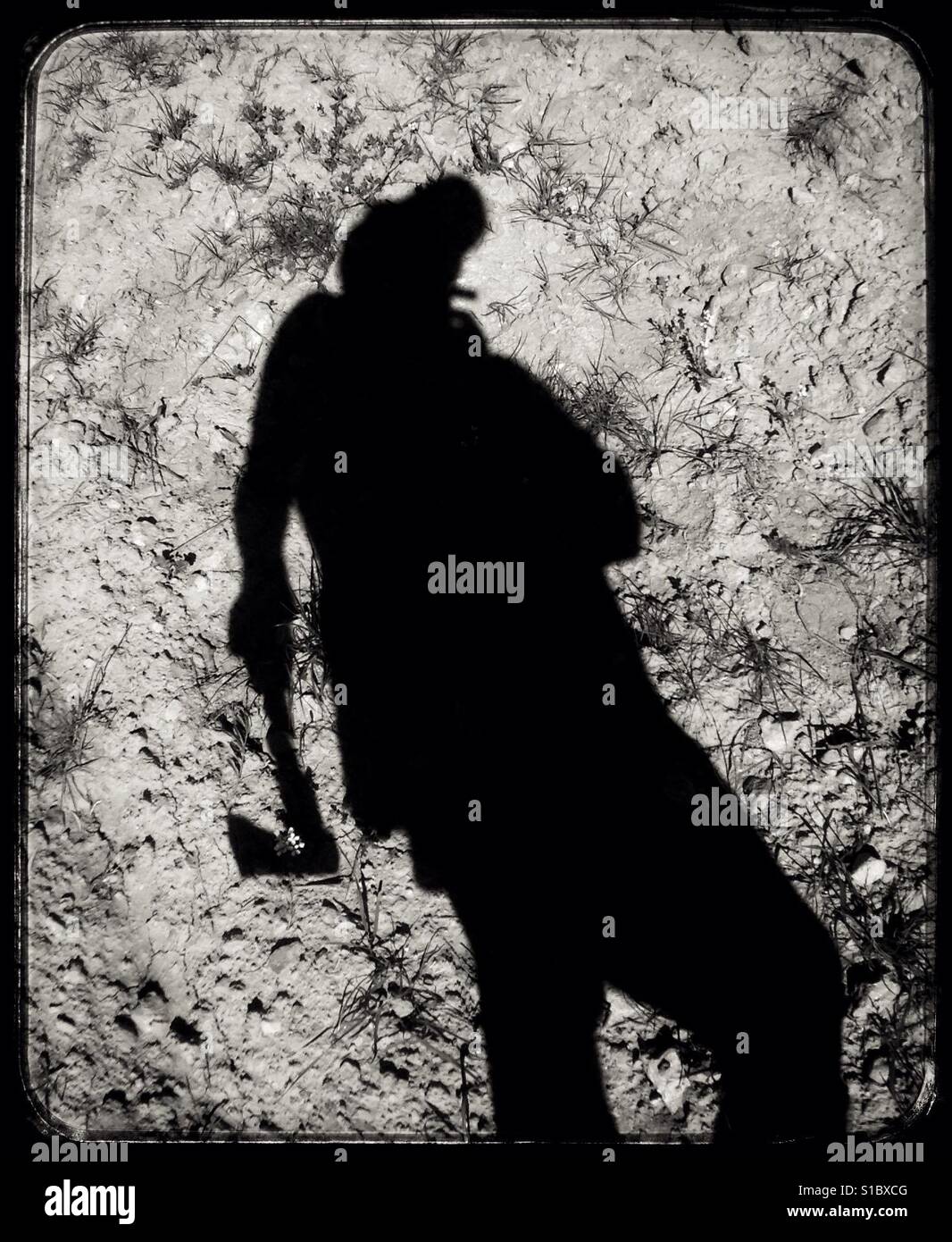 Shadow of a man and hatchet hi-res stock photography and images - Alamy