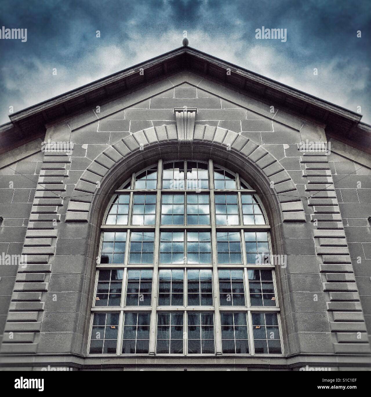 Arched window in 19th century stone building Stock Photo - Alamy