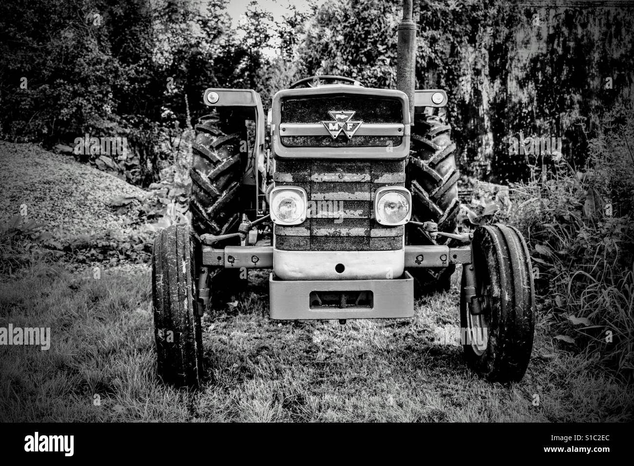 Old vintage tractor in black and white Stock Photo - Alamy