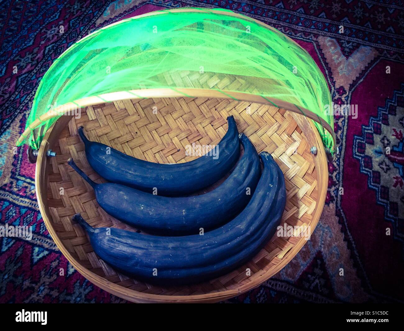 Ripe plantains in a bamboo basket Stock Photo - Alamy