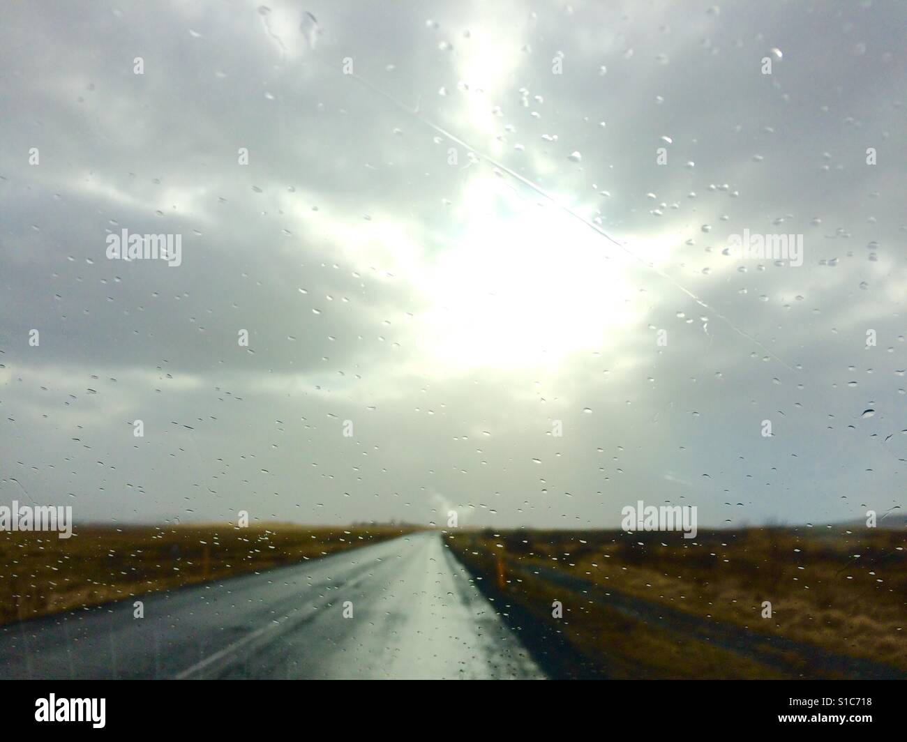 Sun shines through rain clouds hi-res stock photography and images - Alamy